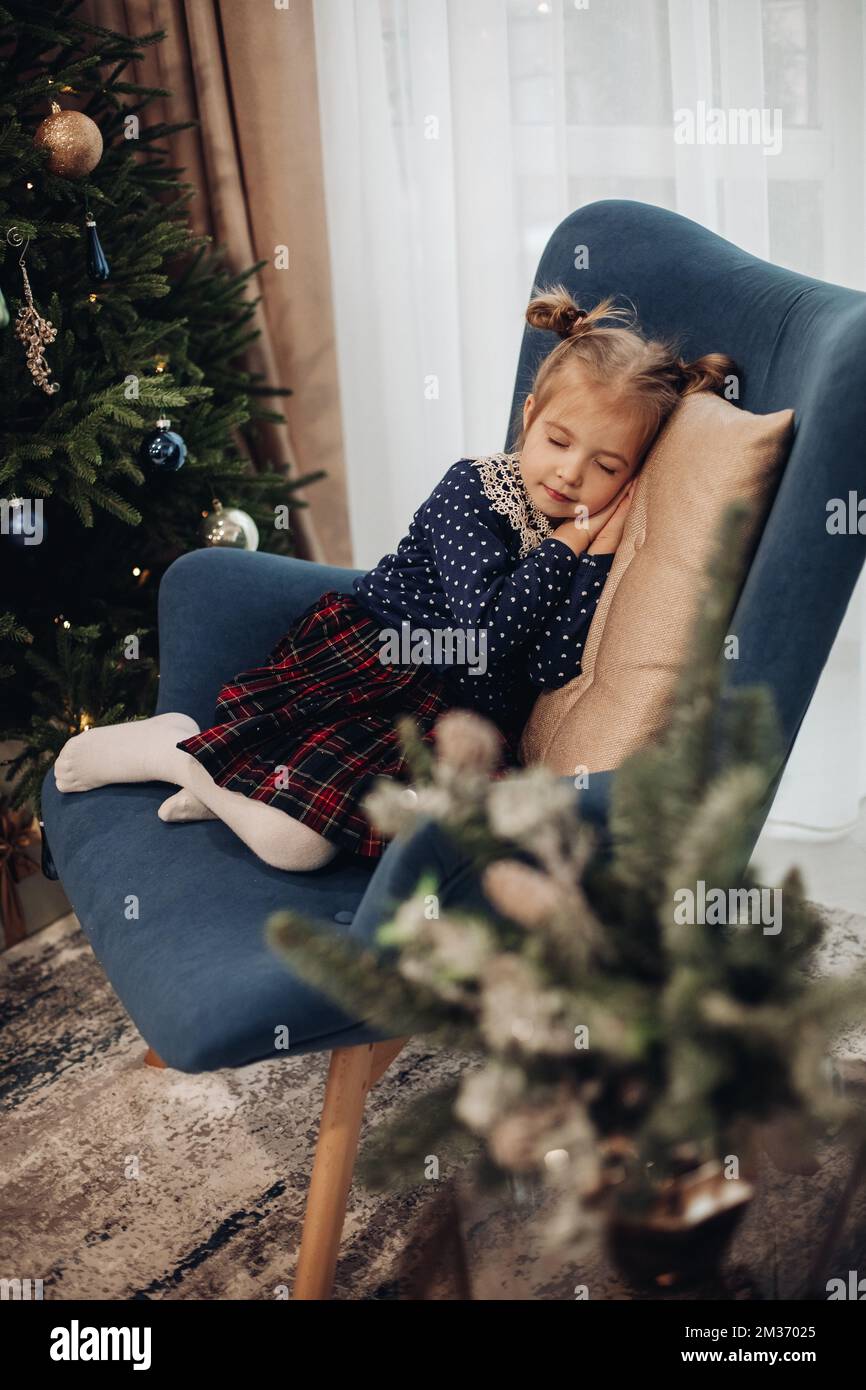 Child sleeping in armchair Stock Photo - Alamy