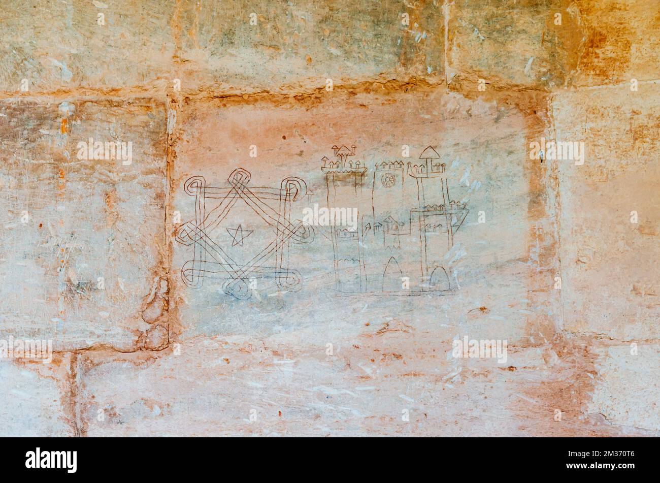 Inscriptions and drawings on the stone wall. The San Millán Suso ...