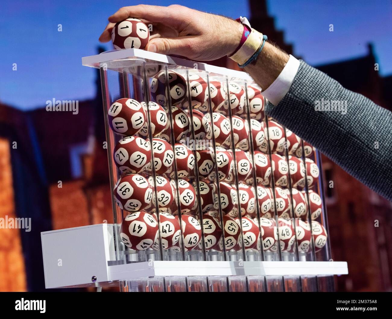 Illustration picture shows a man filling the lottery machine with the ...