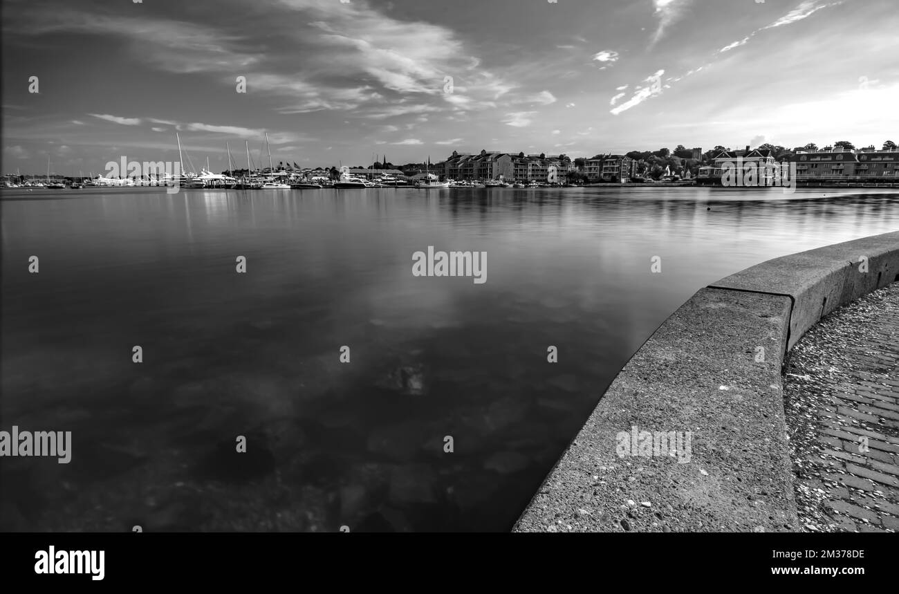 A scenic black and white shot of the stone barricade on the coast in ...