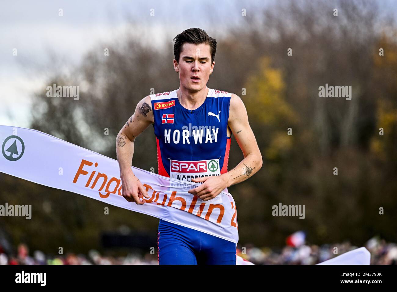 Norwegian Jakob Ingebrigtsen celebrates as he crosses the finish line ...