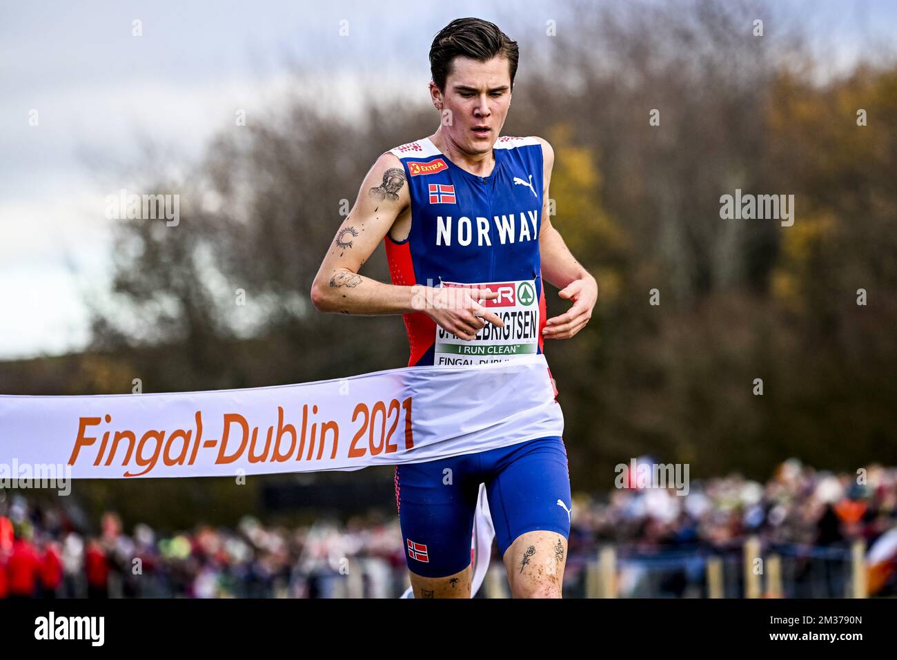 Norwegian Jakob Ingebrigtsen celebrates as he crosses the finish line ...