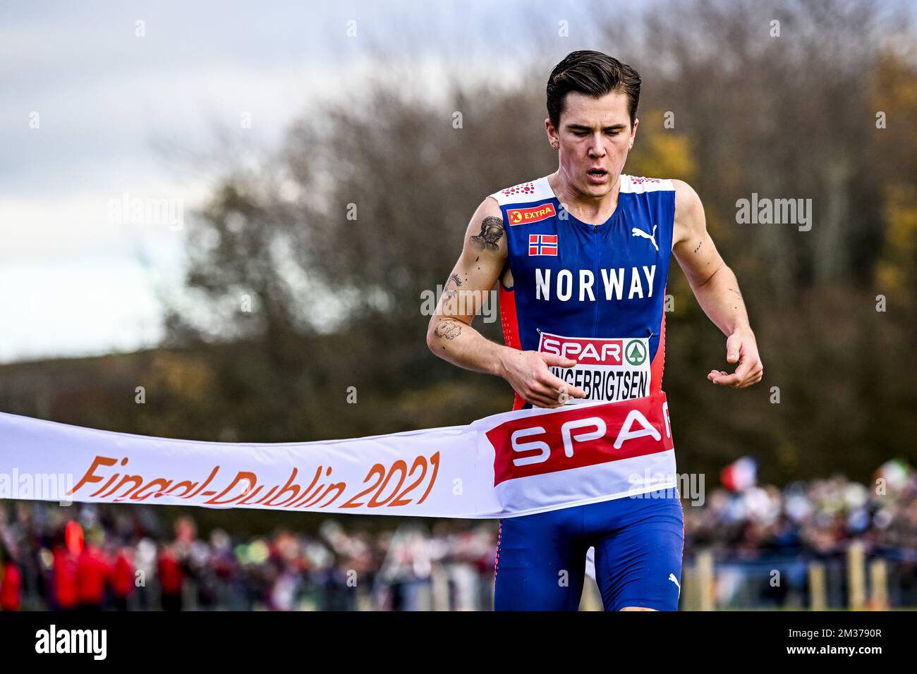 Norwegian Jakob Ingebrigtsen celebrates as he crosses the finish line ...
