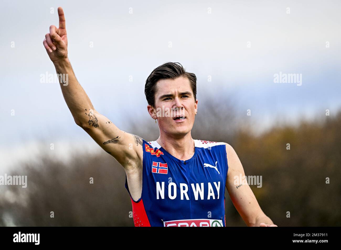 Norwegian Jakob Ingebrigtsen celebrates as he crosses the finish line ...