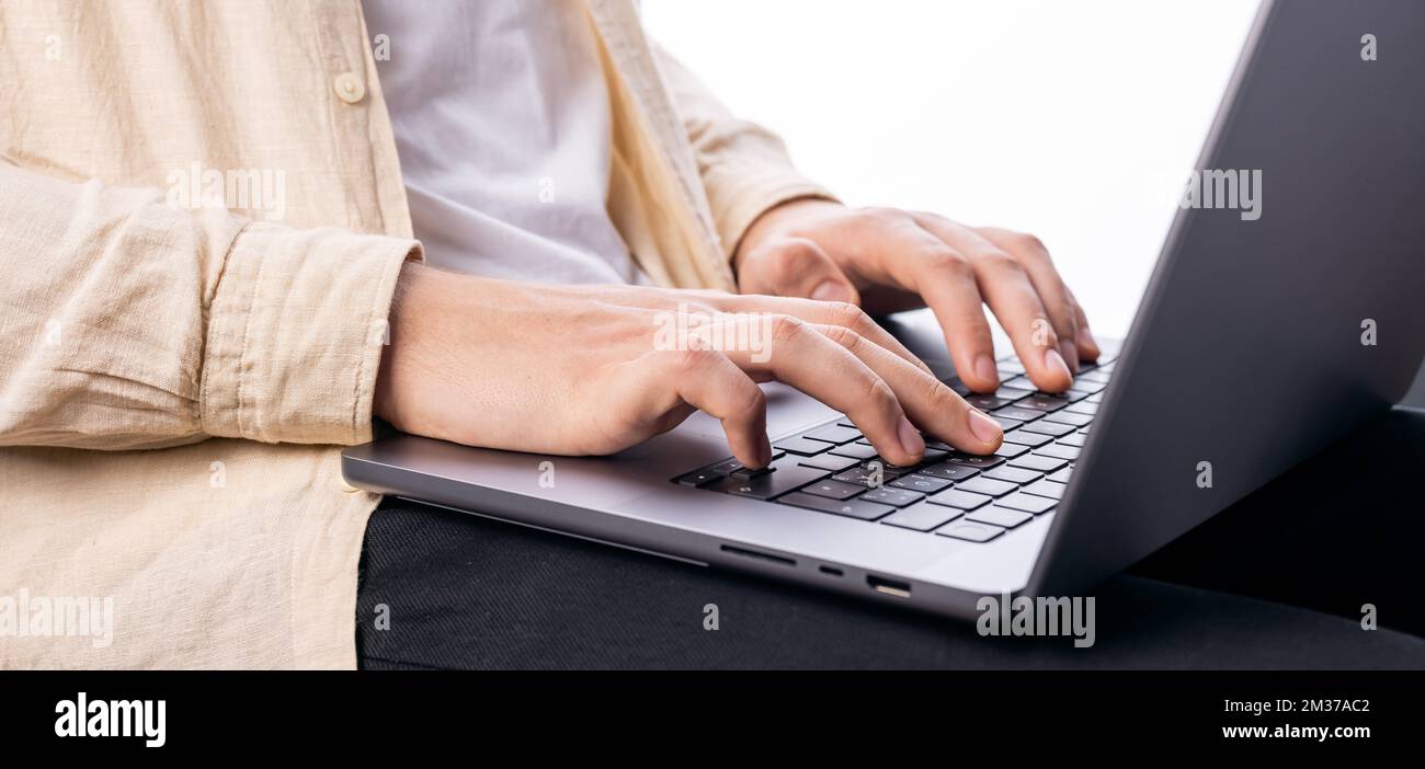 Male hands on laptop keyboard Stock Photo - Alamy