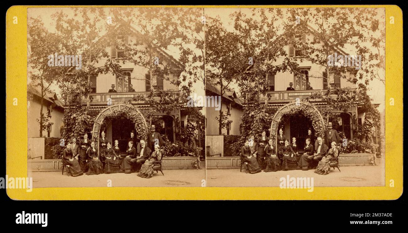 Group photograph of twelve people at the entrance to Vine Cottage, with ...