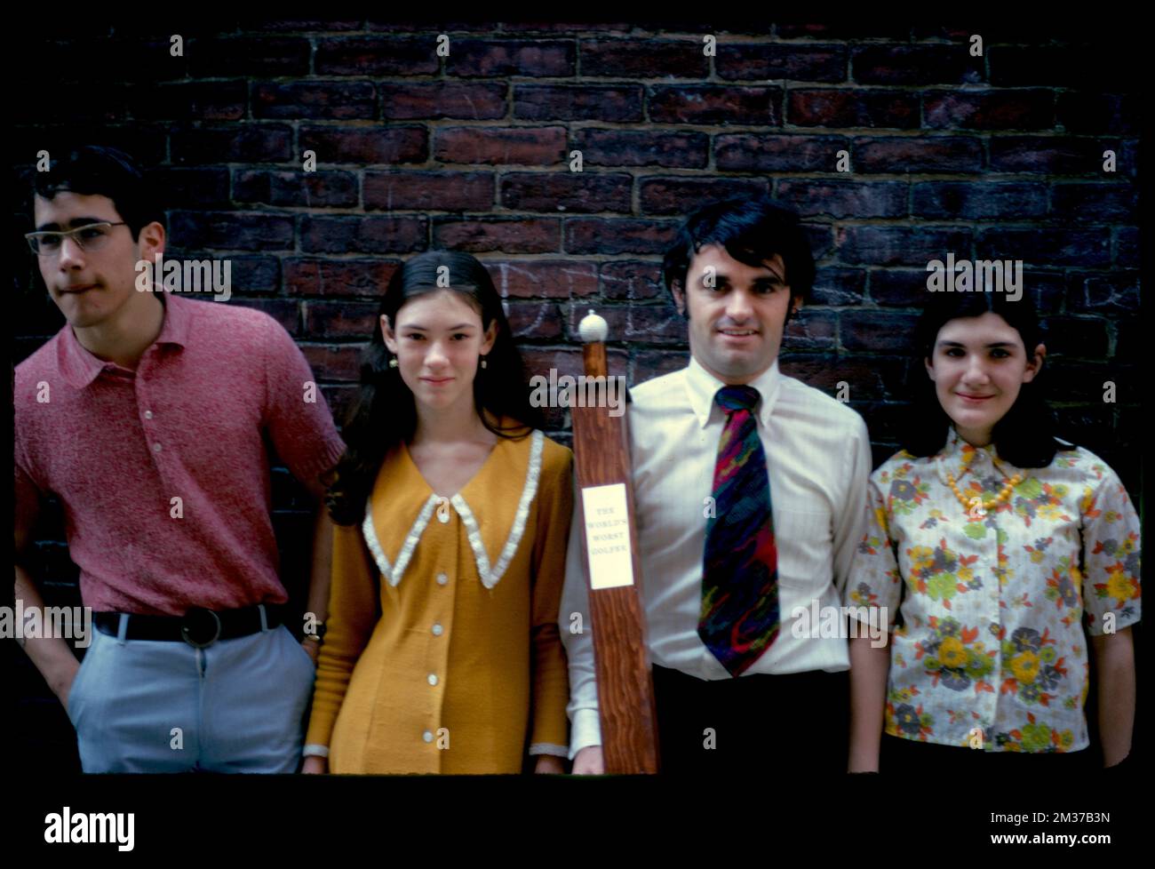 Group posing with World's Worst Golfer trophy , Golfers, Awards. Edmund ...