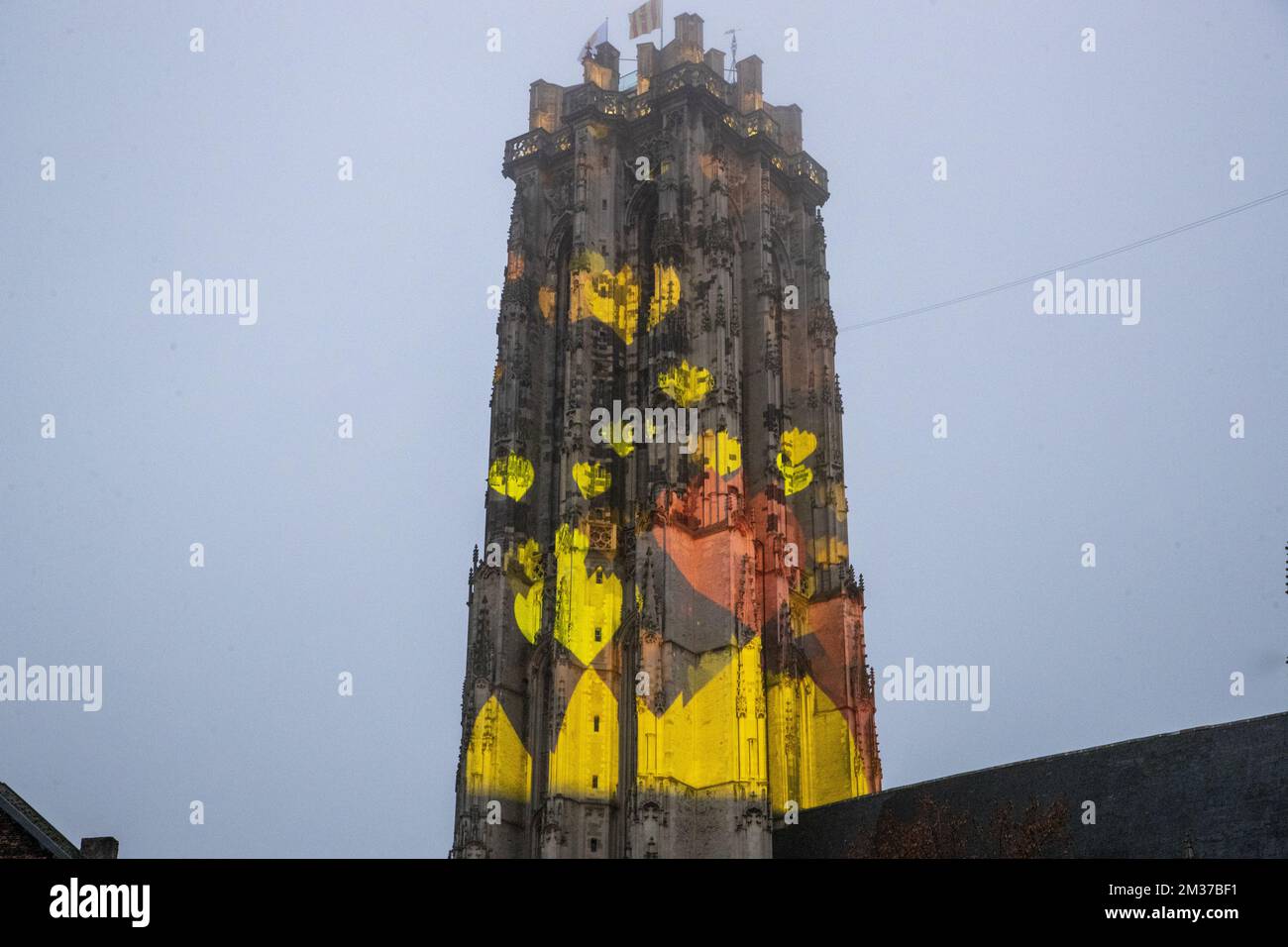 Illustration picture shows a flame projected on the Sint-Romboutstoren ...