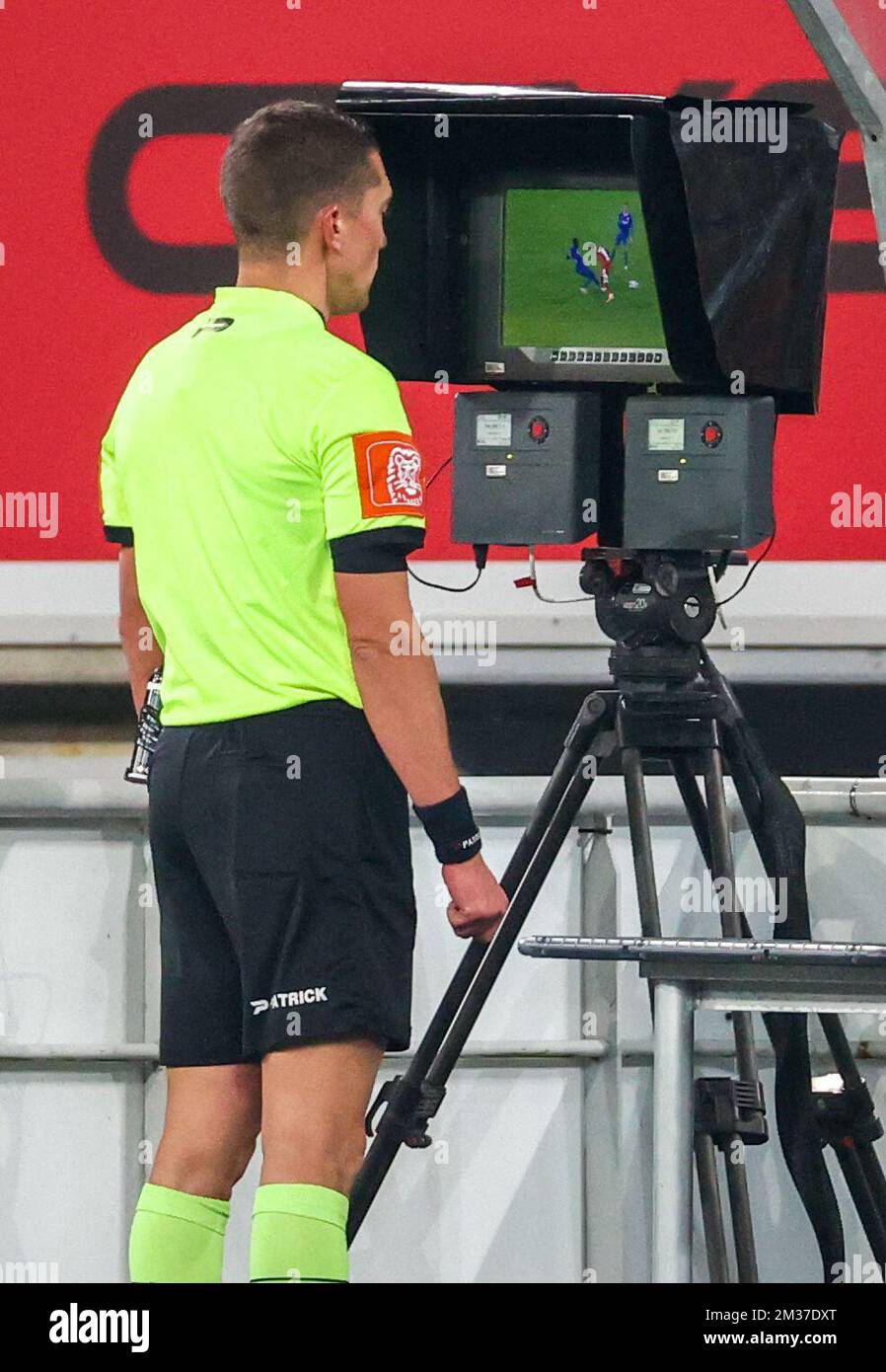 referee Jonathan Lardot pictured watching a scene on the VAR video ...