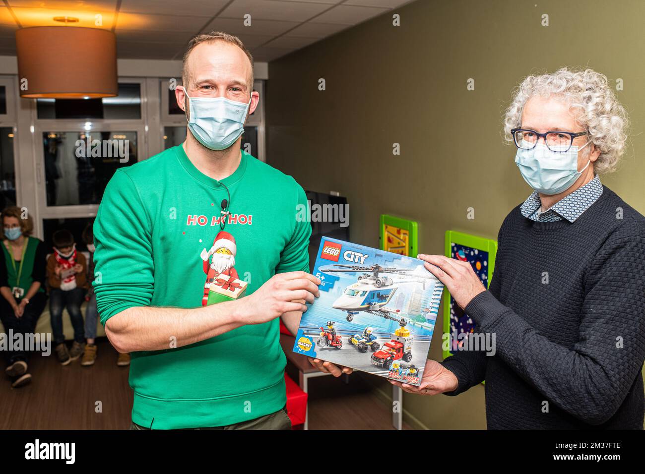 Vincent Andries, Brand Manager LEGO hands a box of Lego to Wim Van de ...