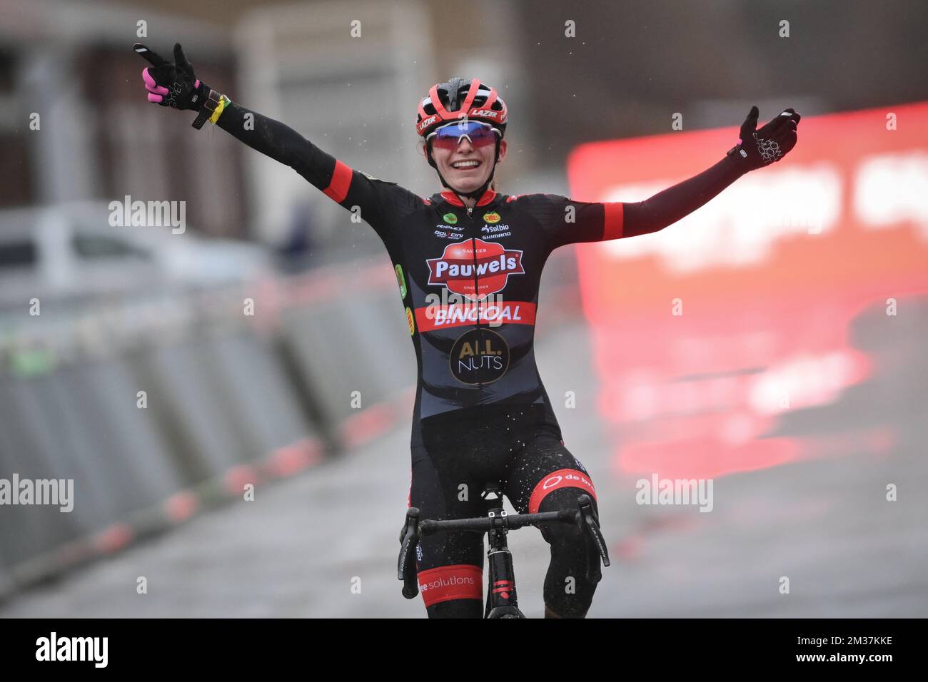 Belgian Shanyl De Schoesitter celebrates as she crosses the finish line ...