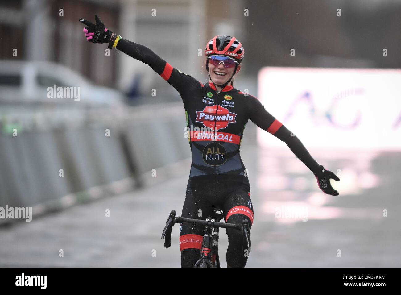 Belgian Shanyl De Schoesitter celebrates as she crosses the finish line ...