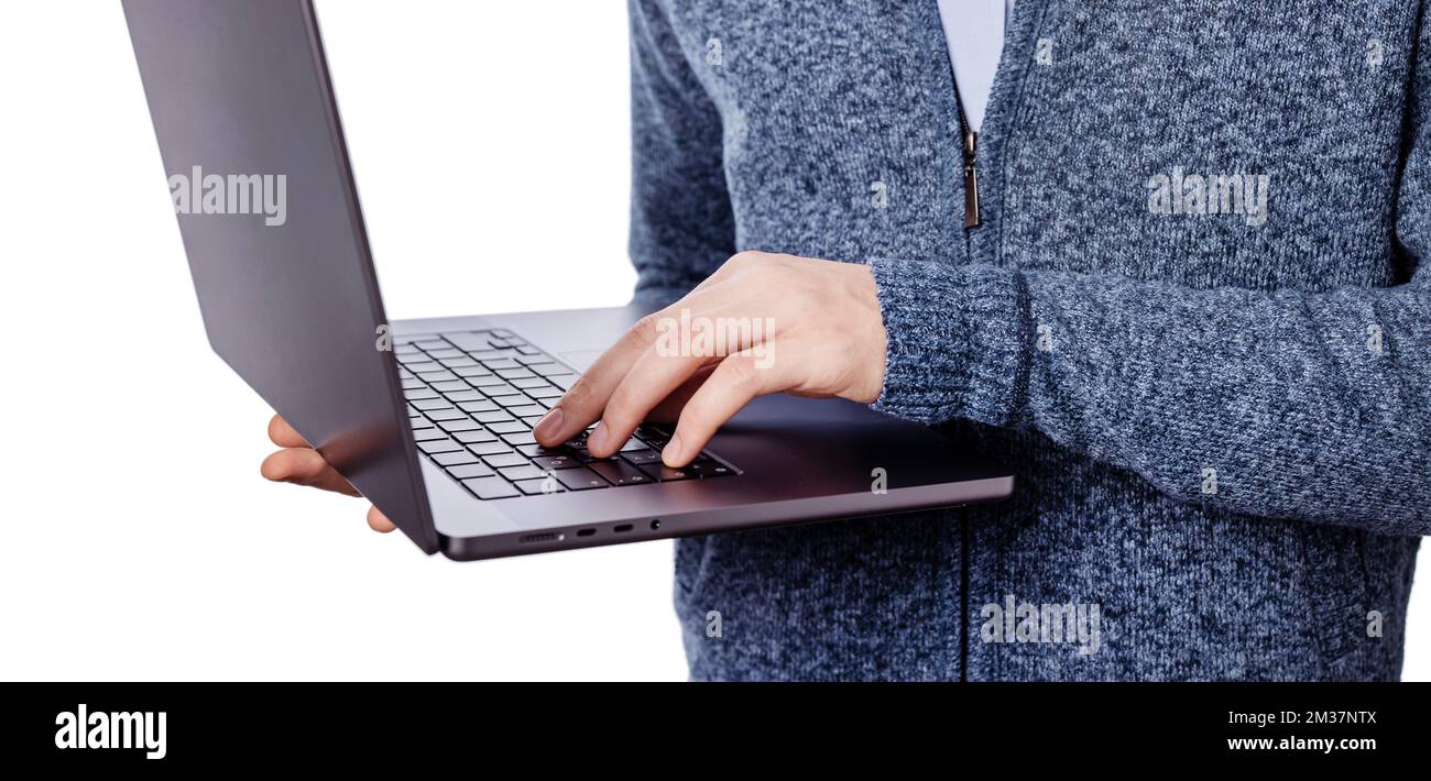 Young businessman holding laptop typing hi-res stock photography and ...