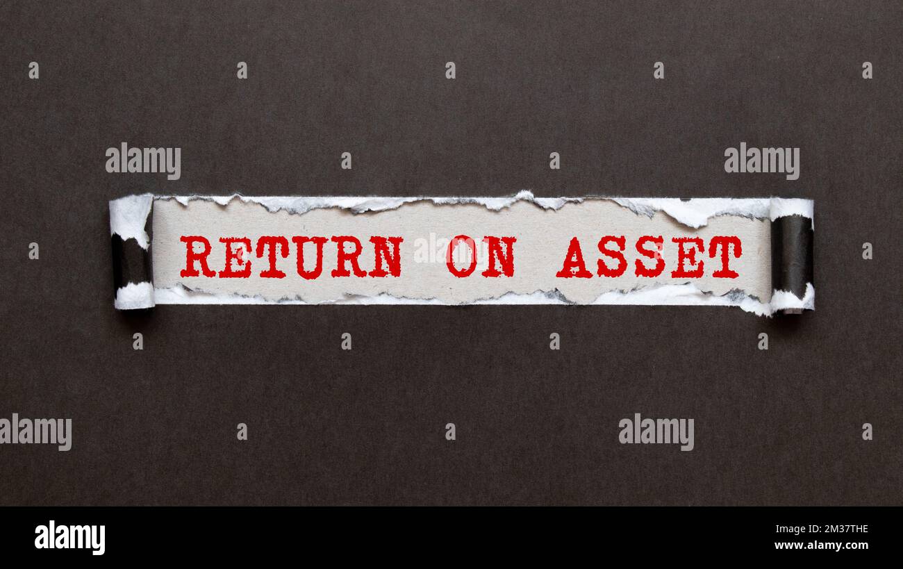 RETURN ON ASSETS words on clipboard, with calculator, magnifier and ...