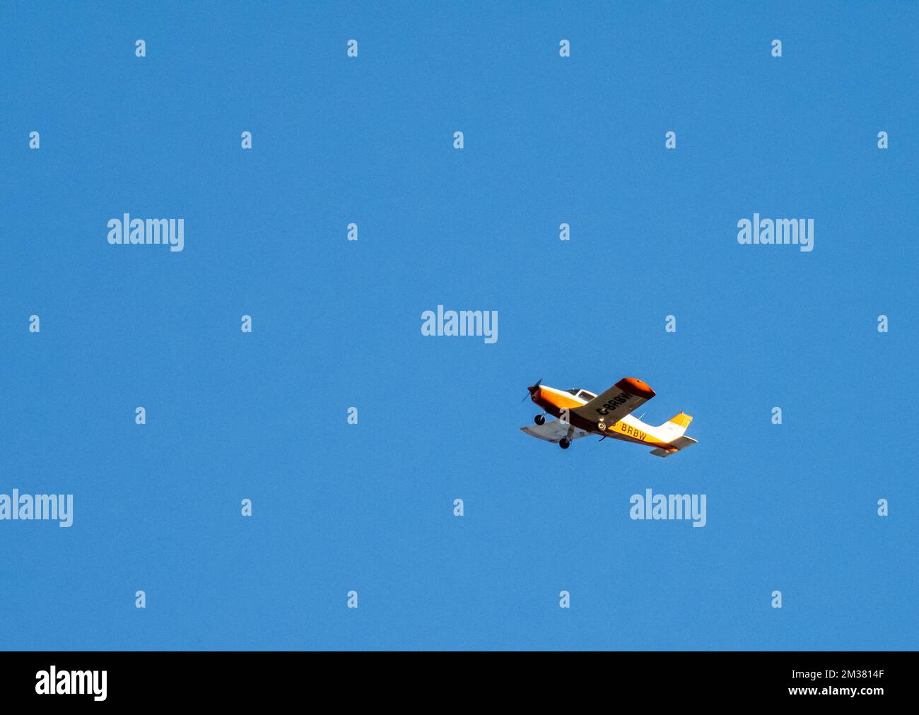 A single prop airplane flying over Ambleside, Lake District, UK Stock ...
