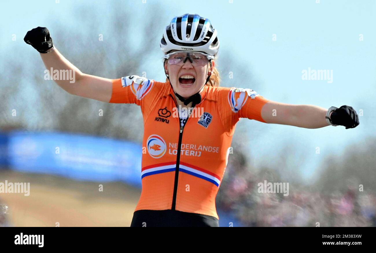 Dutch Puck Pieterse celebrates as she crosses the finish line to win ...