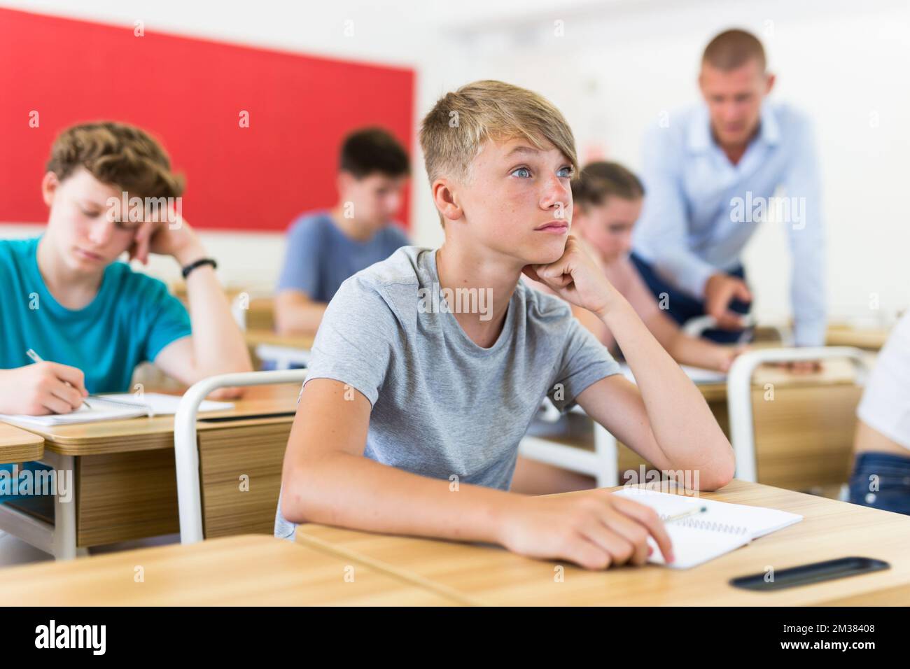 Teen boy sitting in class hi-res stock photography and images - Alamy