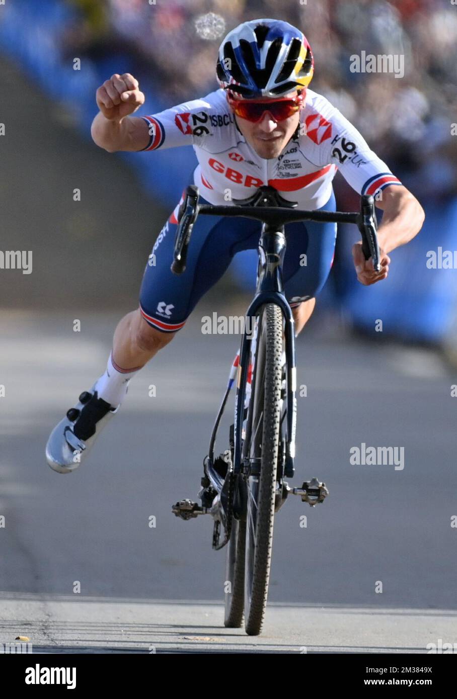British Thomas Pidcock balances on his bike in 'superman' pose, to ...