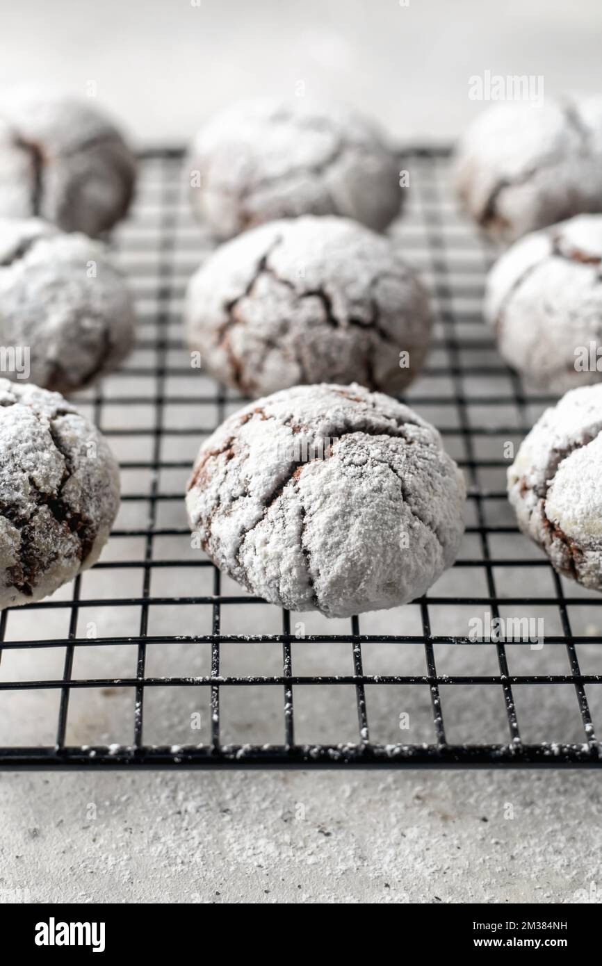 Chocolate chip cookies with cracks. Metallic rack with fresh baked ...