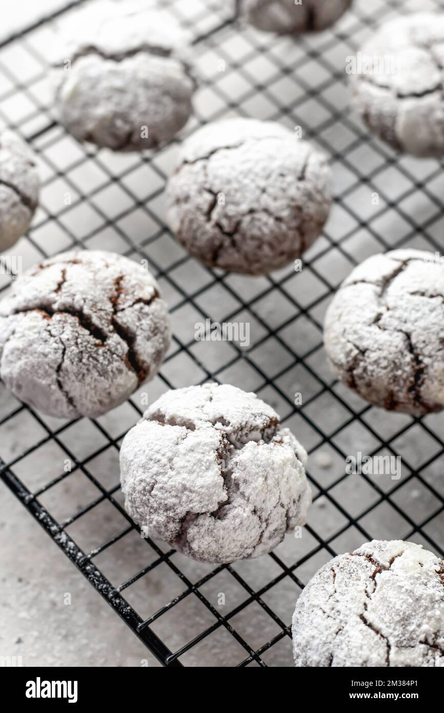 Chocolate chip cookies with cracks. Metallic rack with fresh baked ...