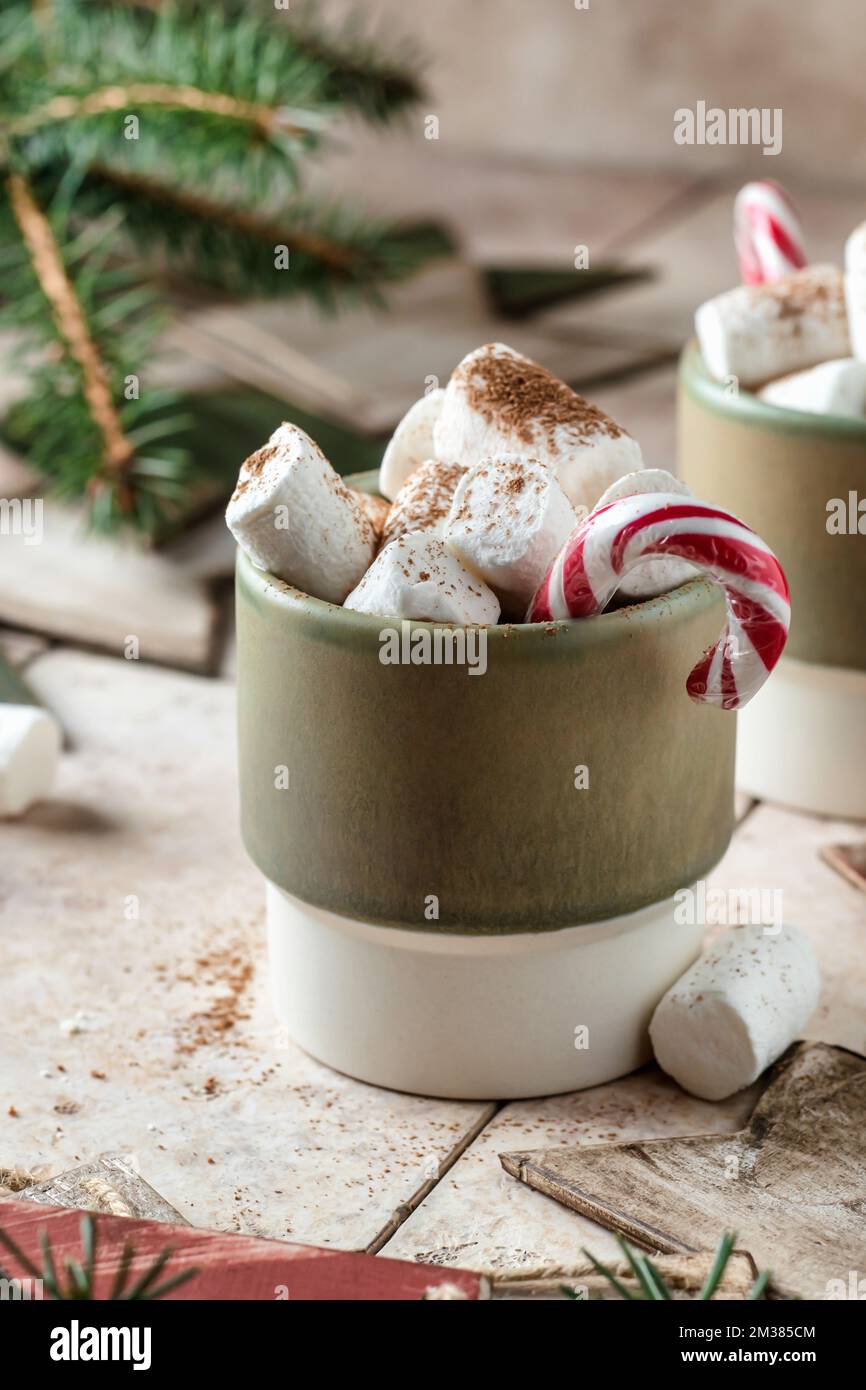 Cup of hot chocolate or cocoa with marshmallow on beige tile background ...