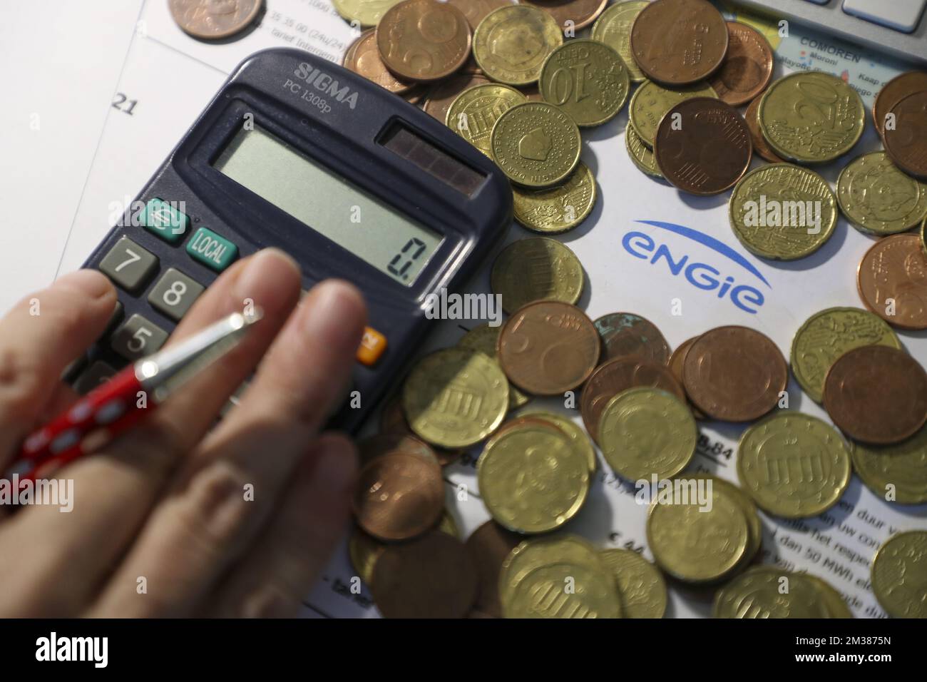 Illustration picture shows a calculator and euro coins, lying on an ...