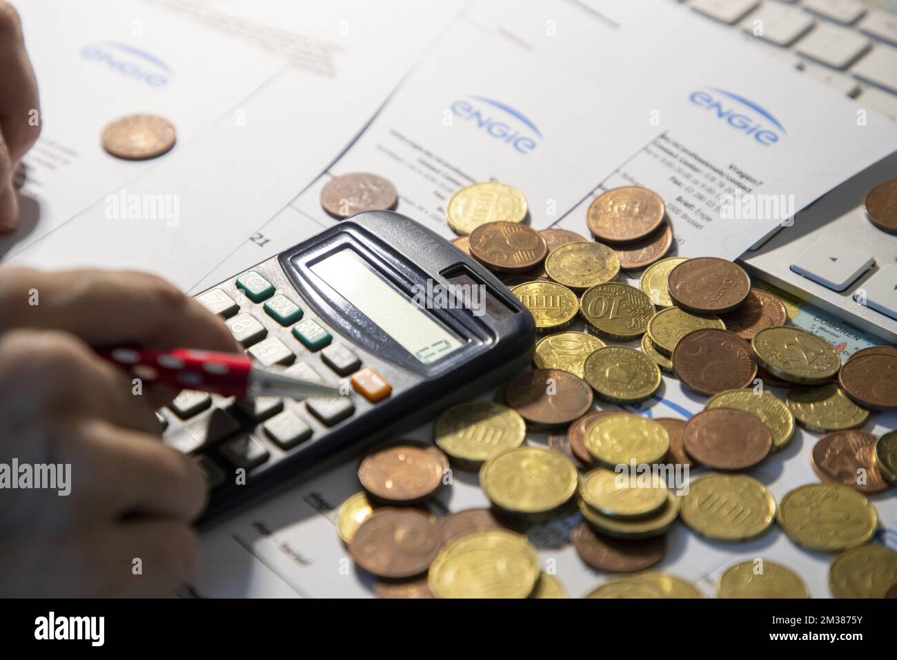 Illustration picture shows a calculator and euro coins, lying on an ...