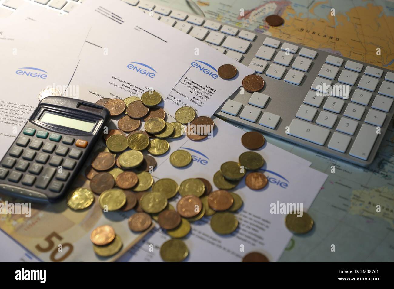 Illustration picture shows a calculator and euro coins, lying on an ...