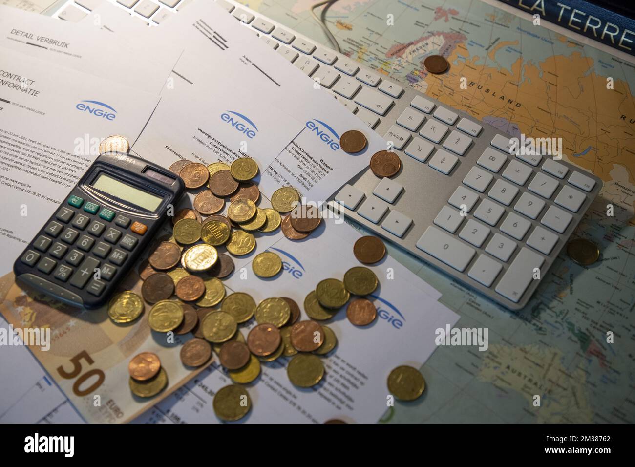 Illustration picture shows a calculator and euro coins, lying on an ...