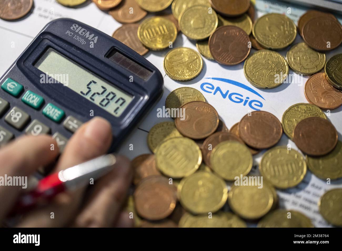Illustration picture shows a calculator and euro coins, lying on an ...
