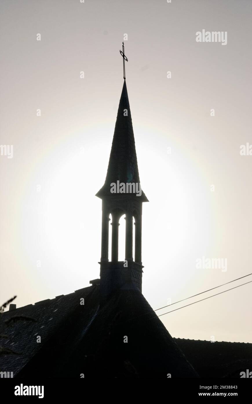 church spire against the light, evening light Stock Photo - Alamy