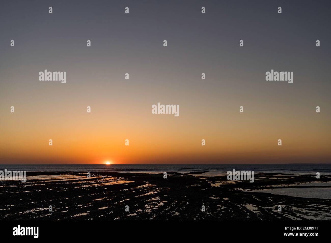 Clear Sunset with sun over ocean, Ile Oleron, france Stock Photo - Alamy