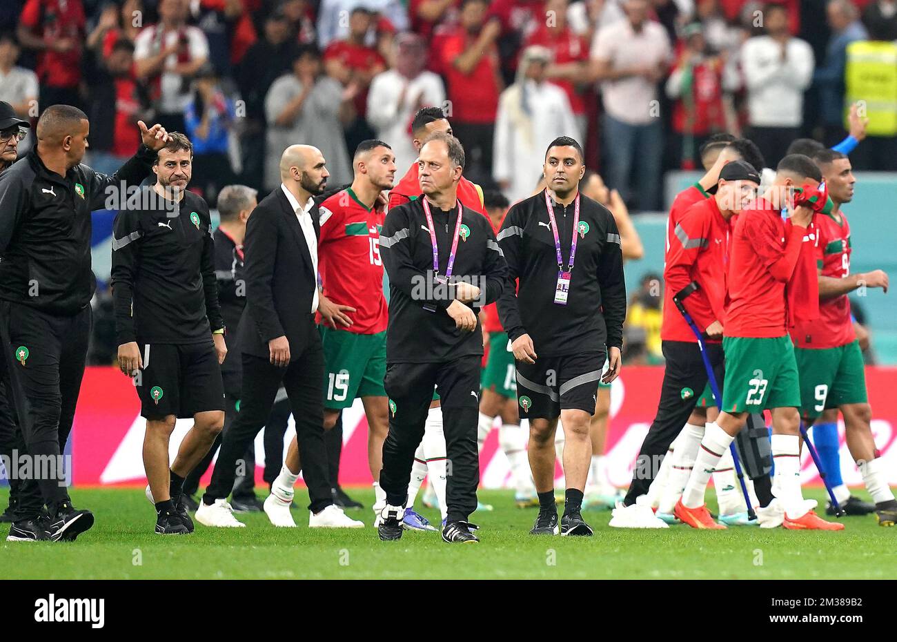 Morocco manager Walid Regragui with players following defeat after the ... Morocco manager Walid Regragui with players following defeat after the ...