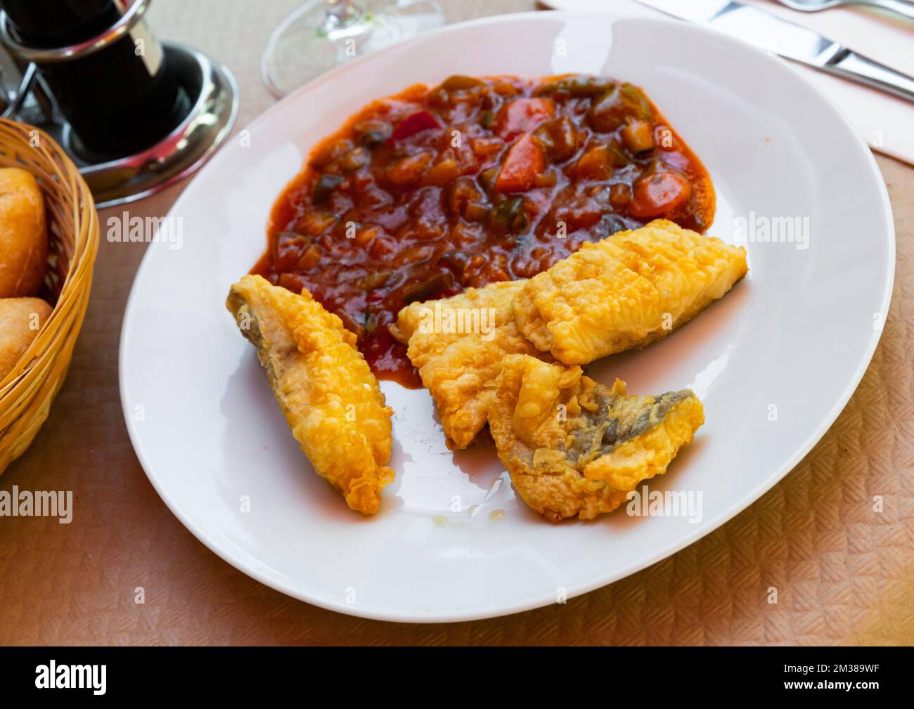 Roasted cod fish with stewed vegetables Stock Photo - Alamy