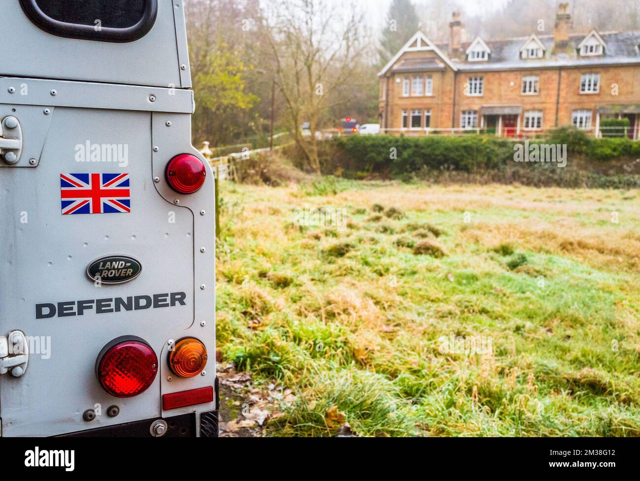 Parked white Landrover Defender 90 county model on a quite country lane ...