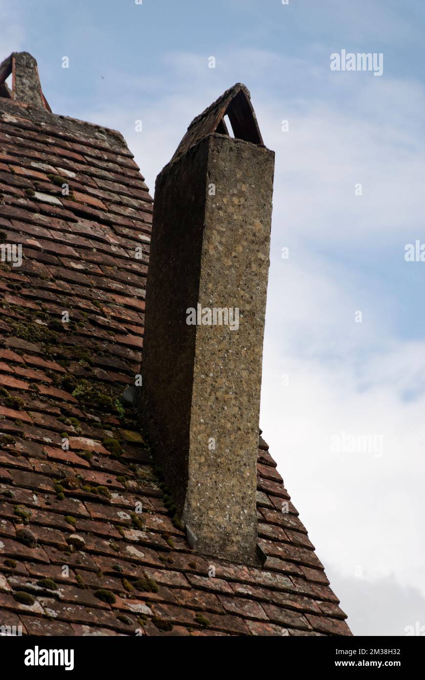 Chimney on a historic house roof with tiles Stock Photo - Alamy