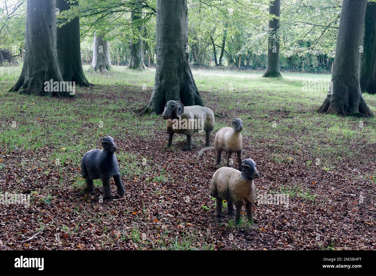Fake sheep in a small woodland part of a pasture - sculptures in a ...