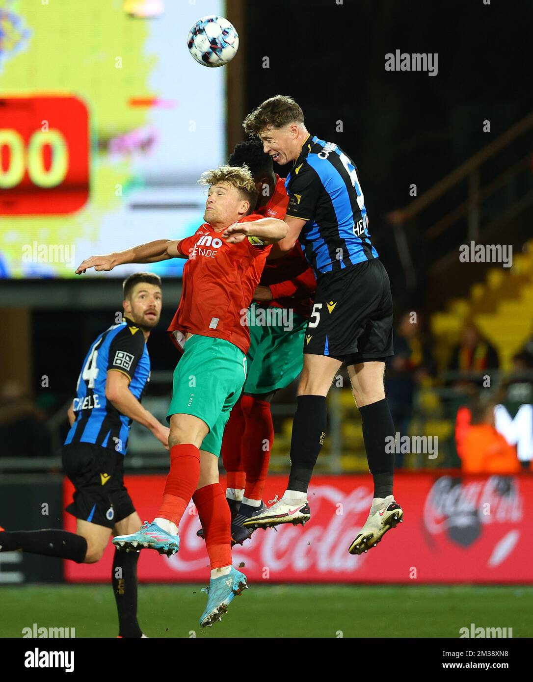 Oostende's Cameron McGeehan and Club's Jack Hendry fight for the ball ...