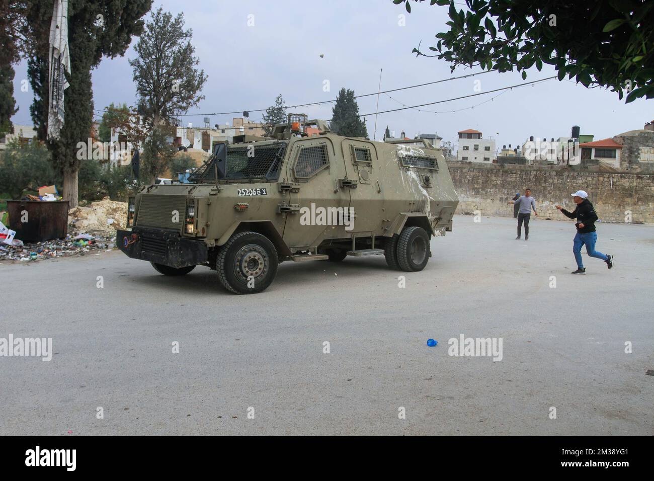 Nablus, Palestine. 14th Dec, 2022. Palestinian youths throw stones at ...