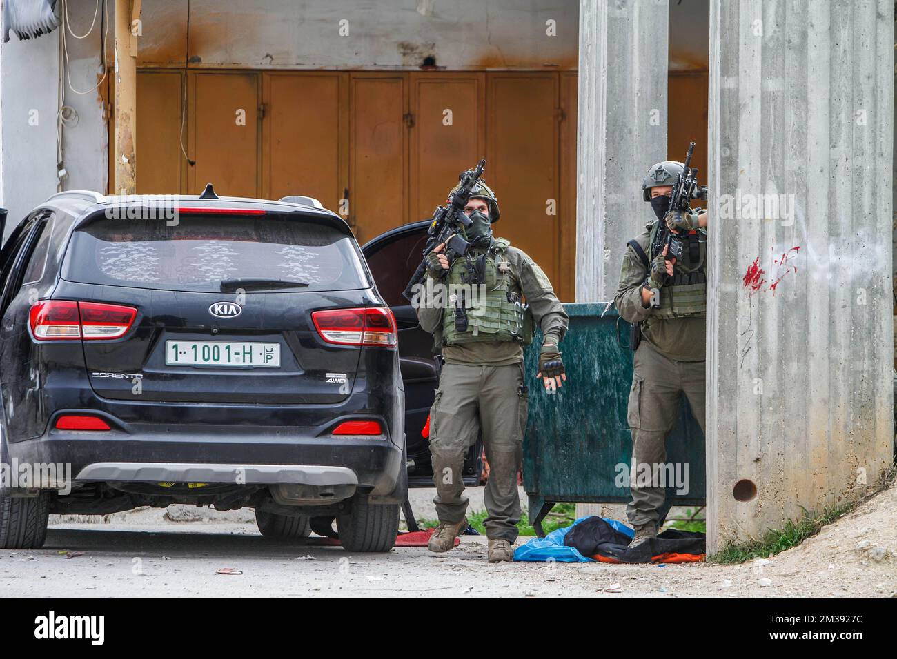 Nablus, Palestine. 14th Dec, 2022. Israeli army forces surround a house ...