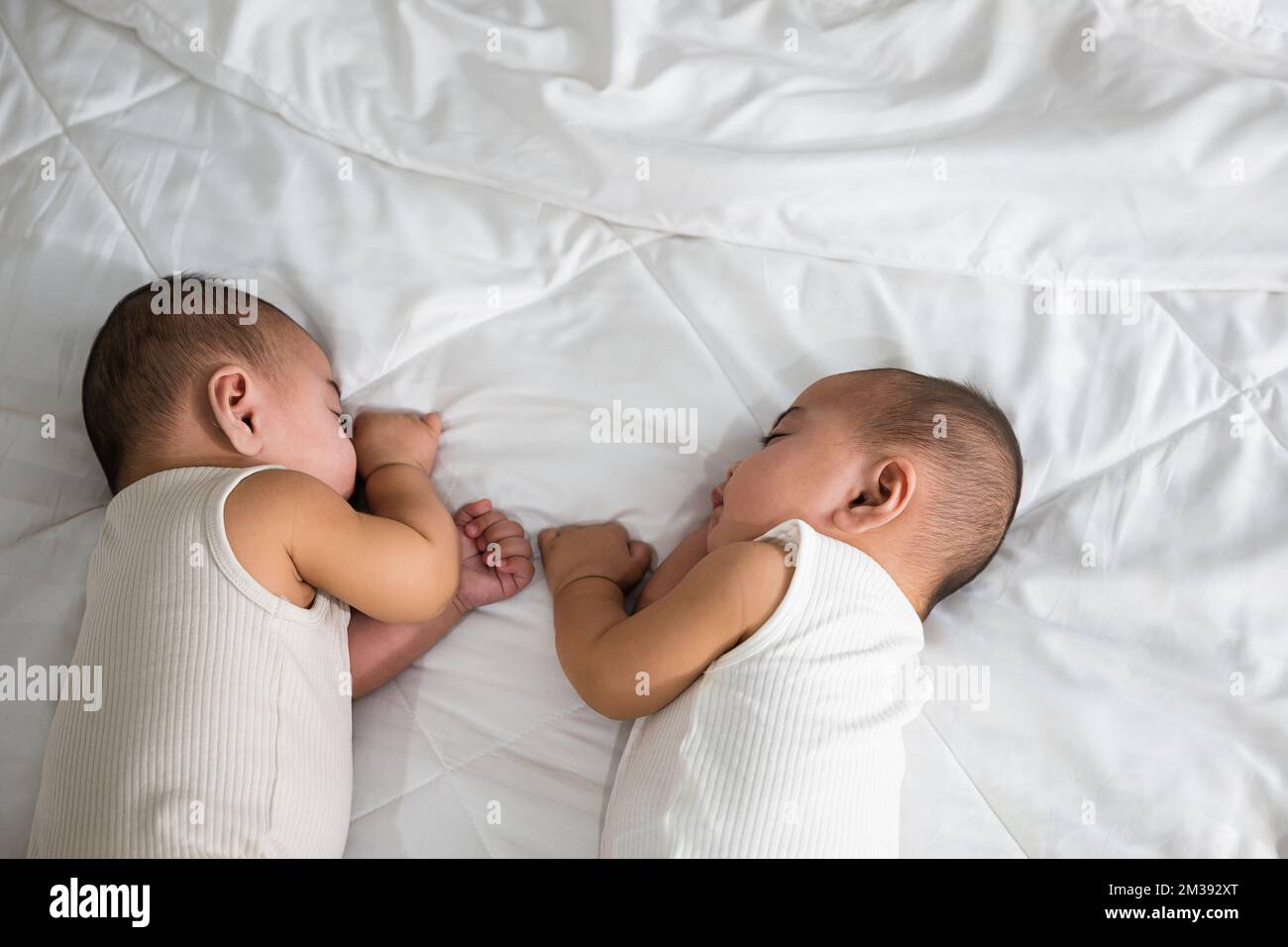 Asian two adorable twin babies boy, Happy childhood Stock Photo - Alamy