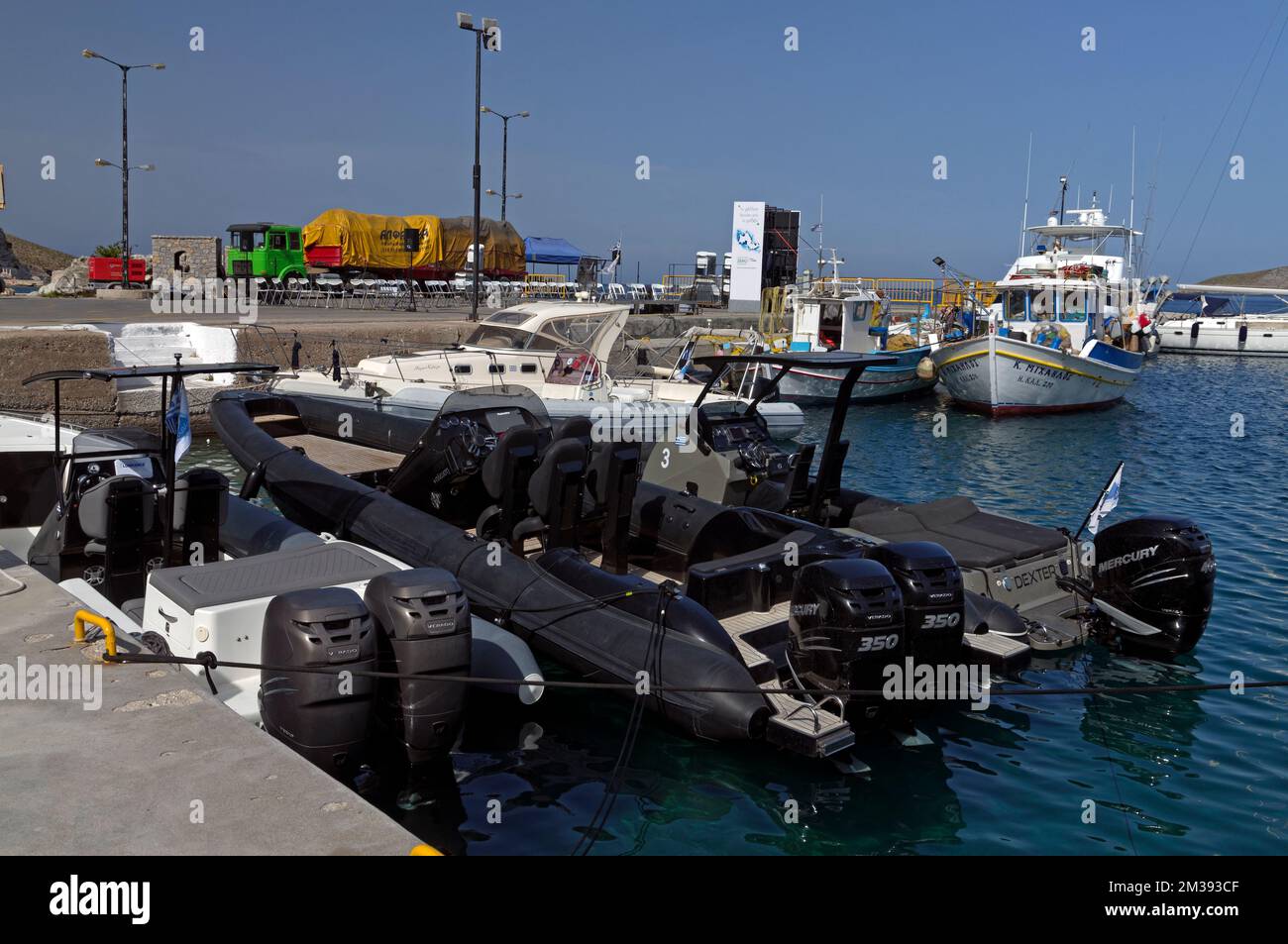 Inflatable power boats with outboard engines at the harbour, Tilos ...