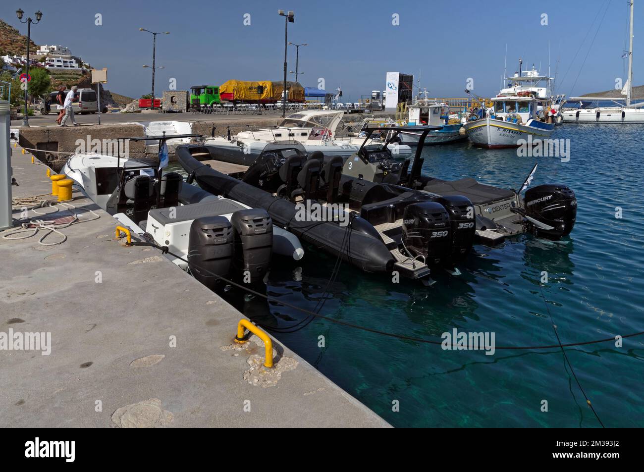Inflatable power boats with outboard engines at the harbour, Tilos ...