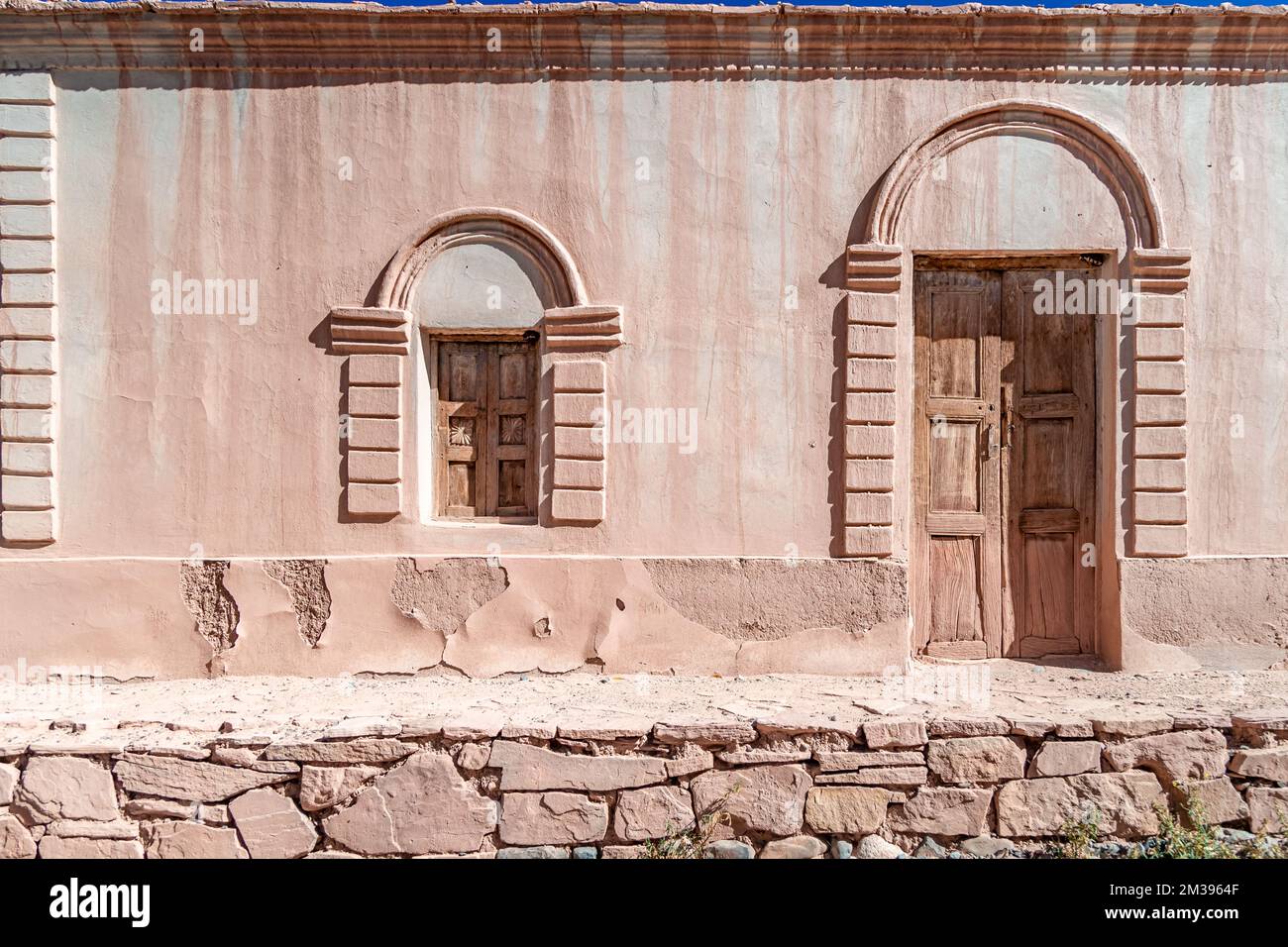 a house made of clay and red bricks in the countryside of Aregenina in ...