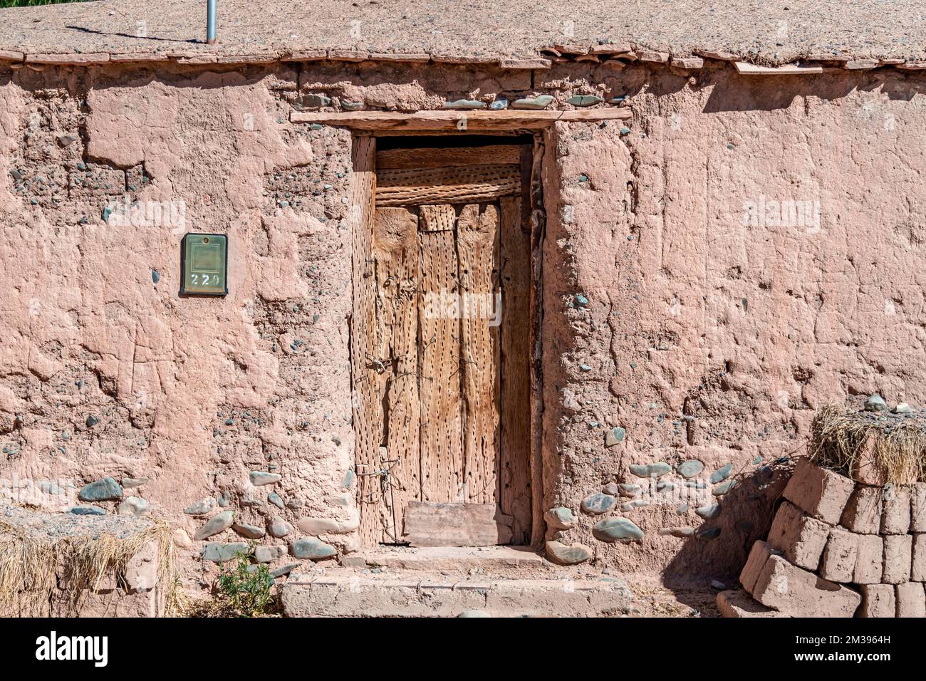 a house made of clay and red bricks in the countryside of Aregenina in ...