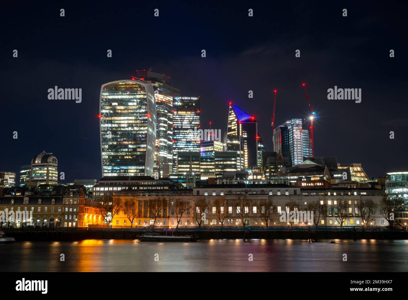 London tower blocks or skyscrapers viewed at night from the south bank ...