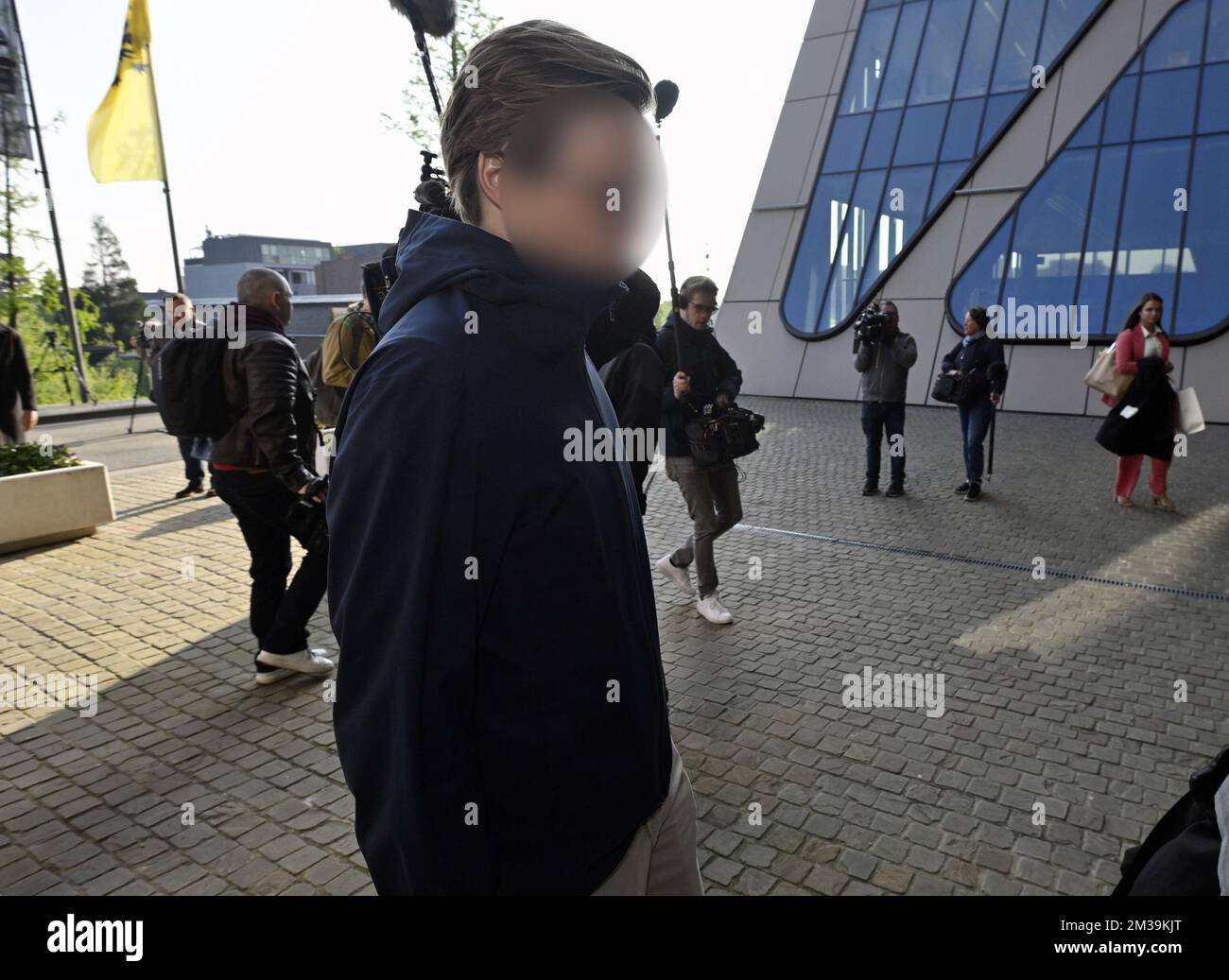 One of the accused arrives for the start of the trial against the 18 ...