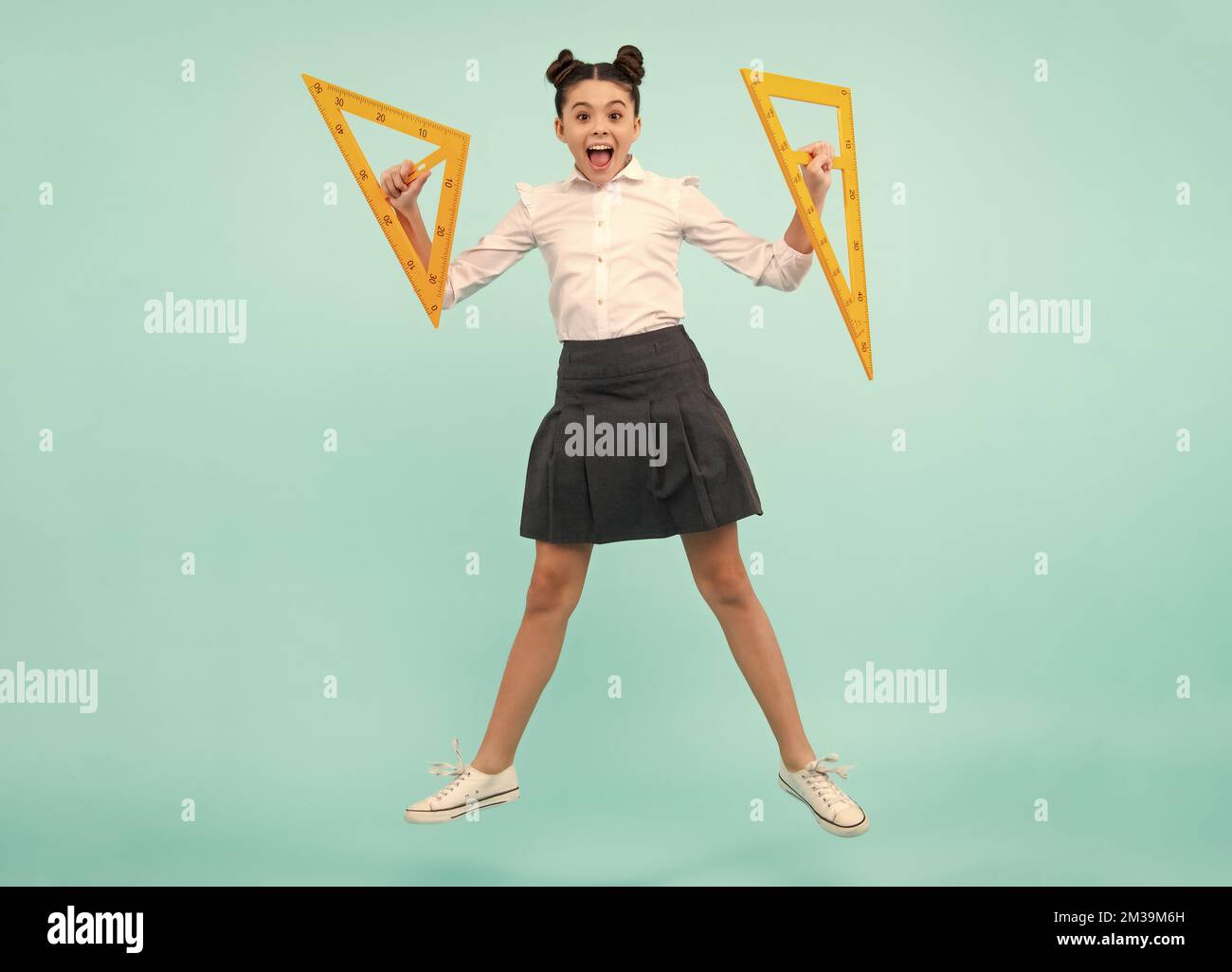 Amazed teenager. Back to school. Teenager school girl on isolated ...