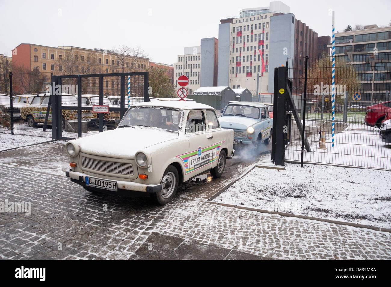 Trabant cars in Berlin leaving the Trabi World compound on a cold snowy ...