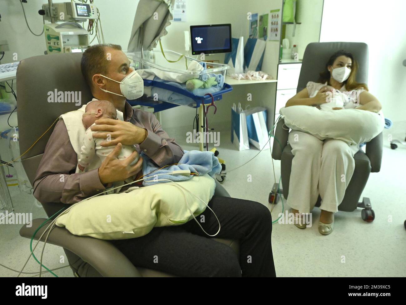 Illustration picture shows people holding their newborn babies, during ...